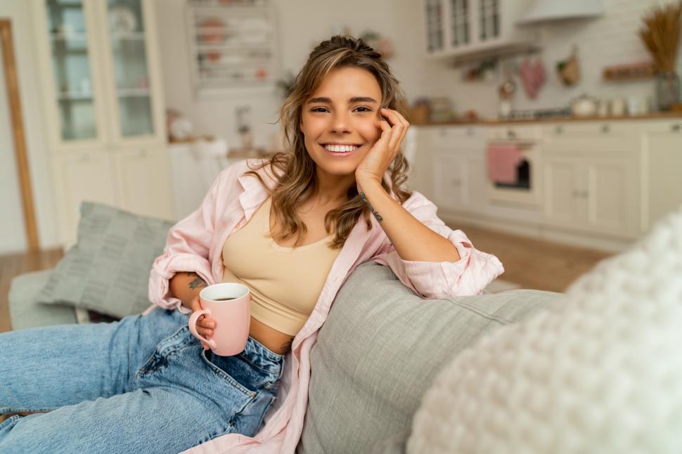 Free Stock Photo of Woman in casual clothes resting on sofa in cozy ...