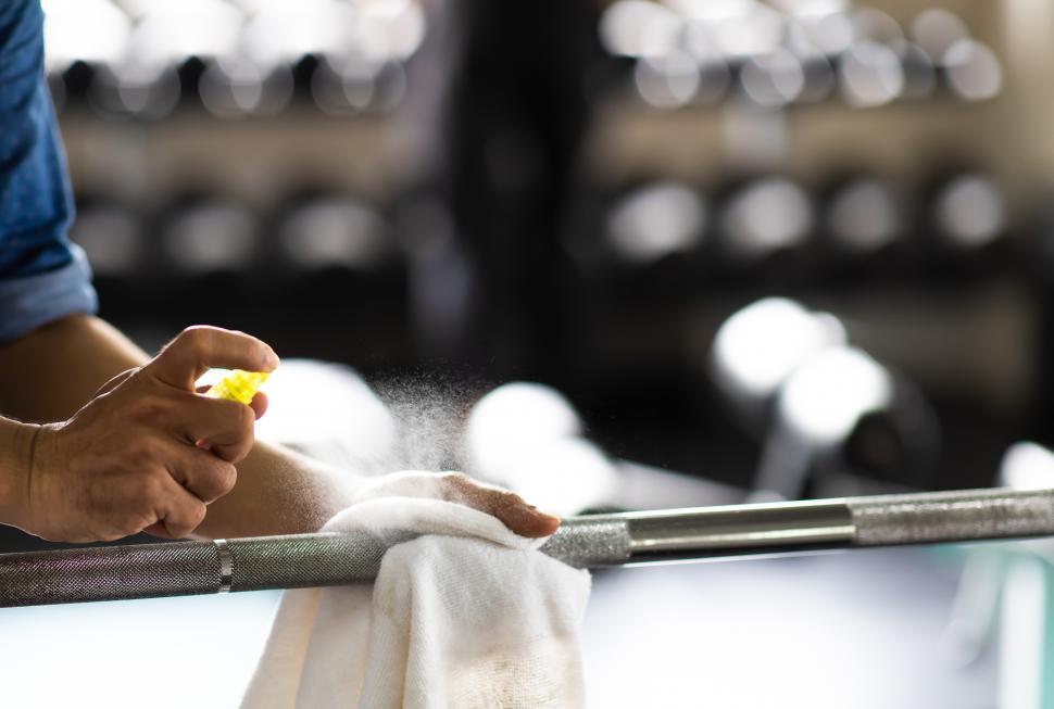 Free Stock Photo of Fitness staff cleaning exercise equipment ...