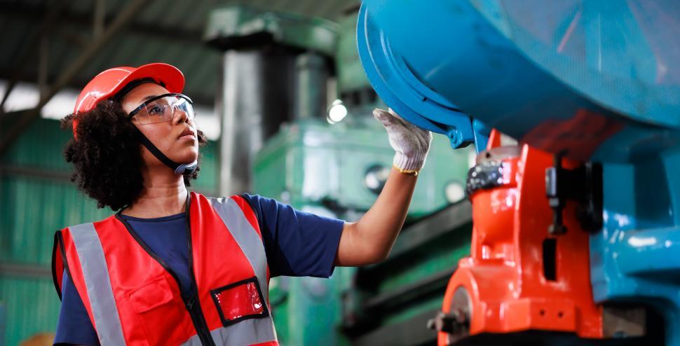 Free Stock Photo of Woman wearing safety goggles controls machine ...