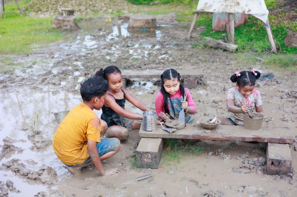 Free Stock Photo of Young children playing in puddle mud together ...