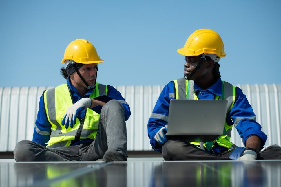 Free Stock Photo of Engineers consult on solar panel installation ...