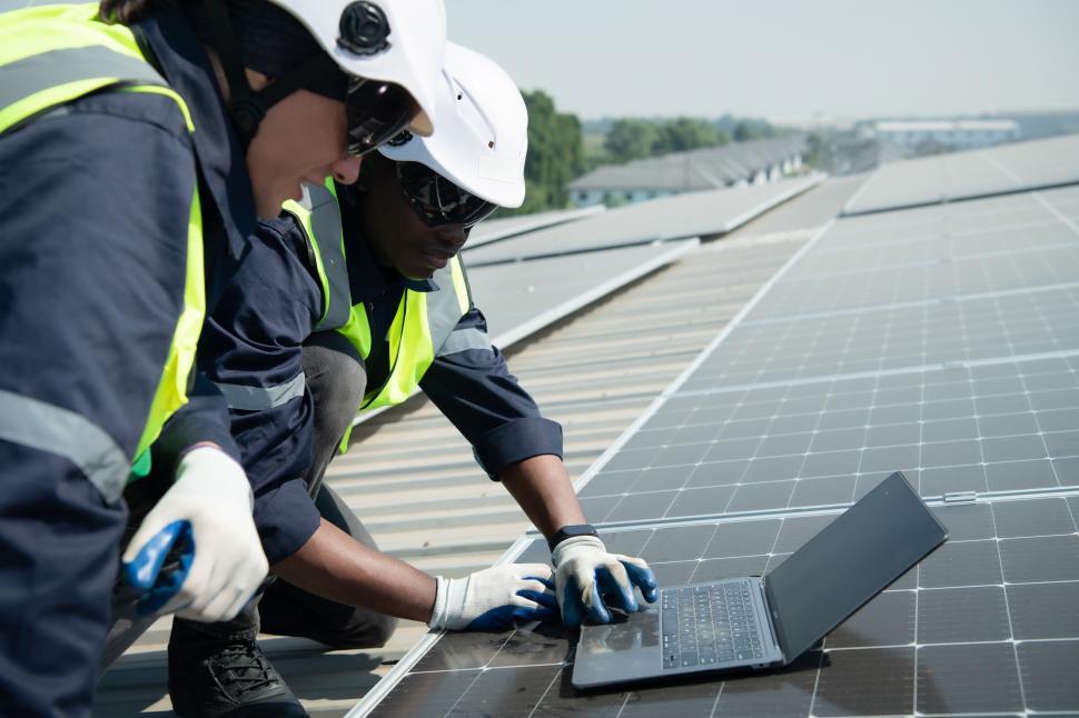 Free Stock Photo of Rooftop solar engineers monitoring performance ...