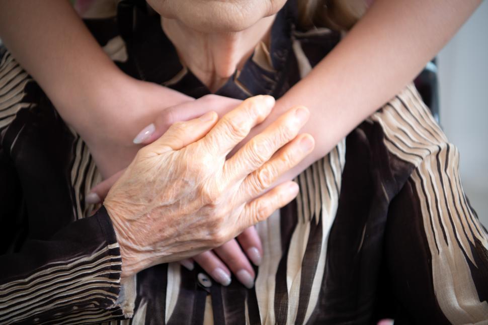 Free Stock Photo of Hand of an elderly woman clasp hands of younger ...