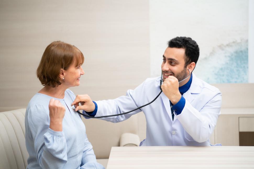 Free Stock Photo of Physician listening to heart beat of female patient ...
