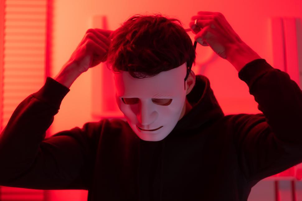 Free Stock Photo of Man putting on white mask to hide his identity ...