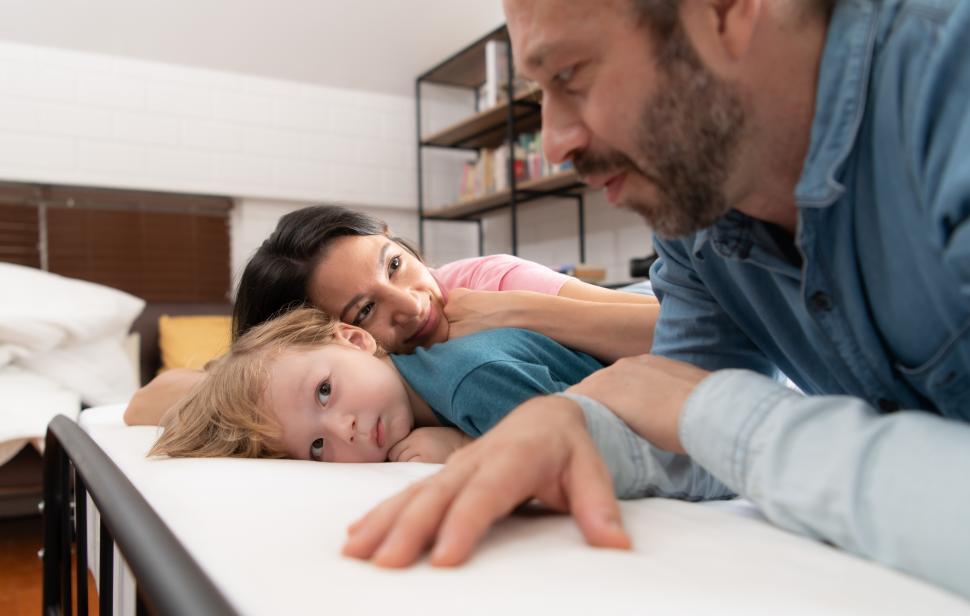 Free Stock Photo of Mother and father help the little boy wake up from ...