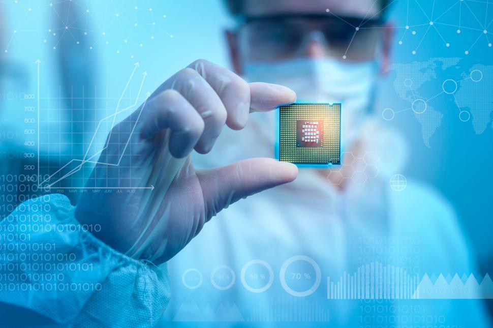 Free Stock Photo of Engineer in sterile suit is holding microchip with ...