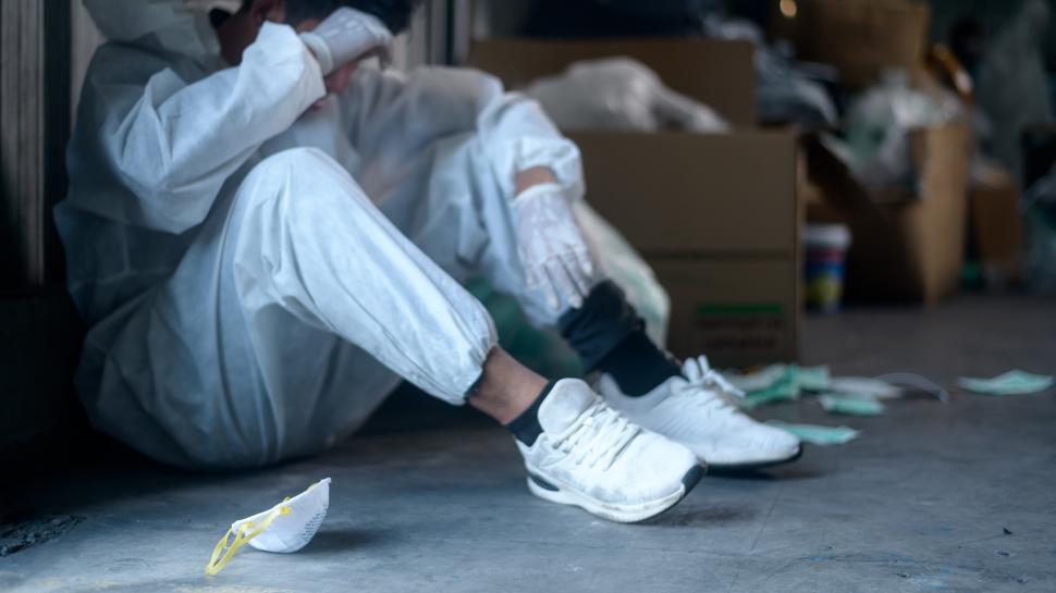 Free Stock Photo of Worker in PPE exhausted and tired in Waste ...