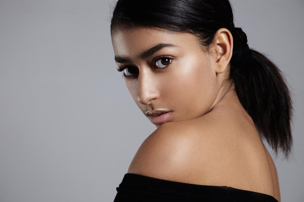 Free Stock Photo of shy woman turned back to camera, looks over ...