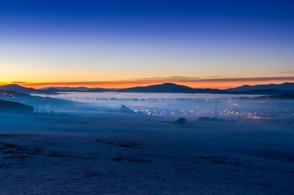 Free Stock Photo of A foggy landscape with a city in the distance ...