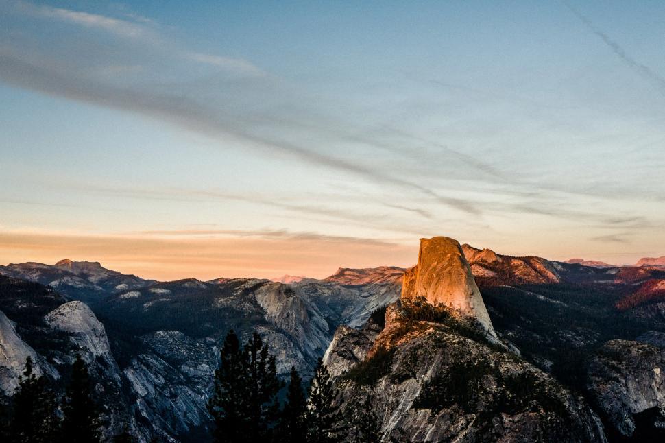 Free Stock Photo of A mountain with trees and a rock formation ...