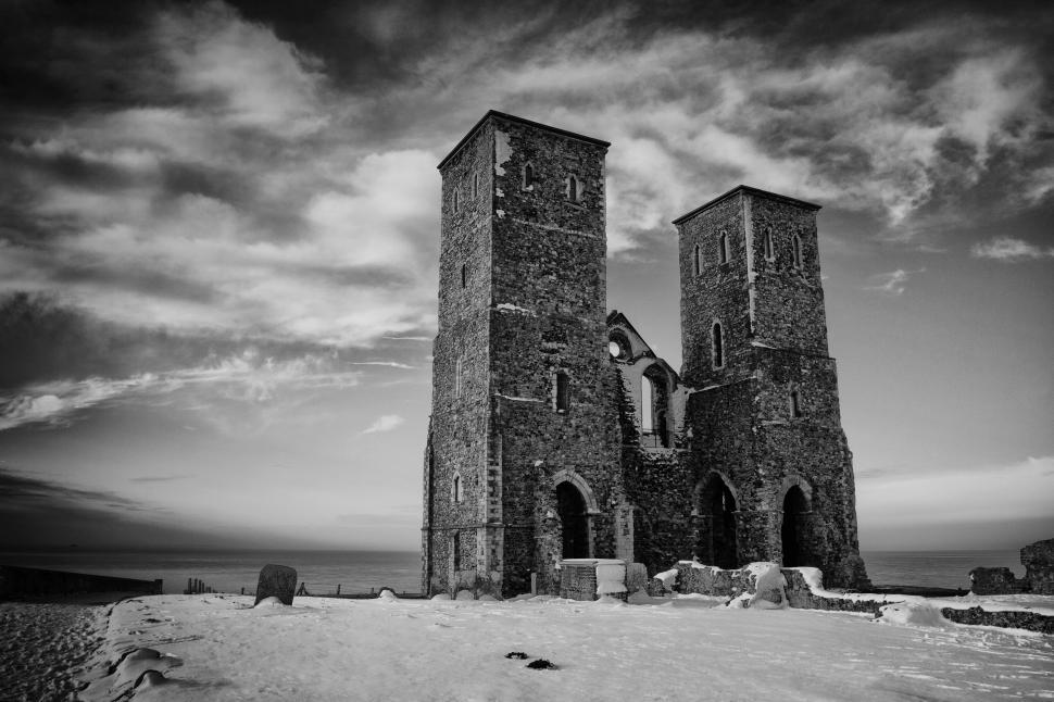 Free Stock Photo of A stone building with two towers in the snow ...