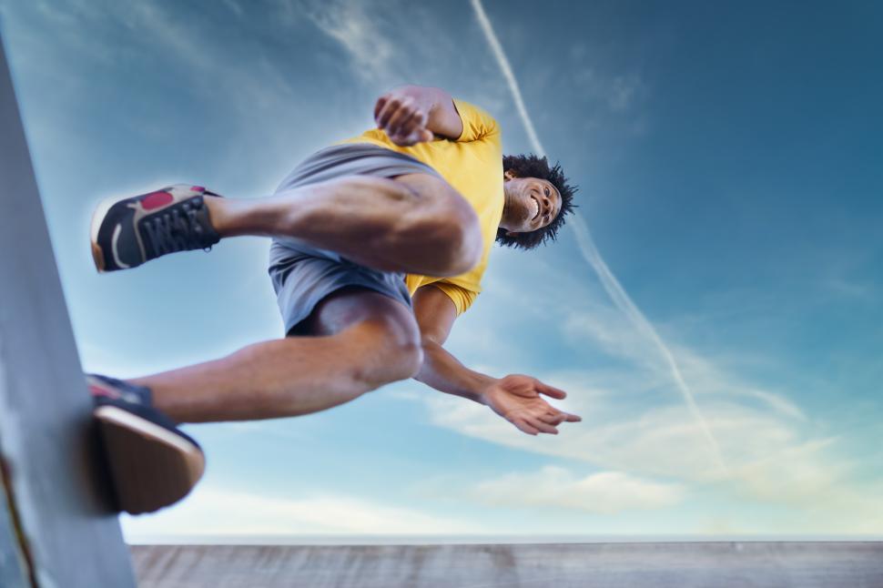 Free Stock Photo of View from below of black man jumping on his run ...