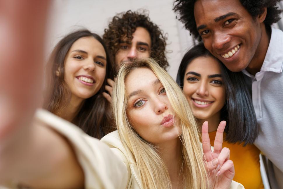Free Stock Photo of Multi-ethnic group of friends taking a selfie together while having fun ...