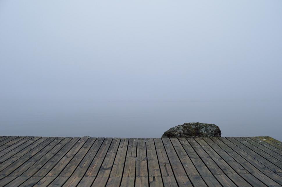 Free Stock Photo of A wooden deck with a rock on the side of it ...