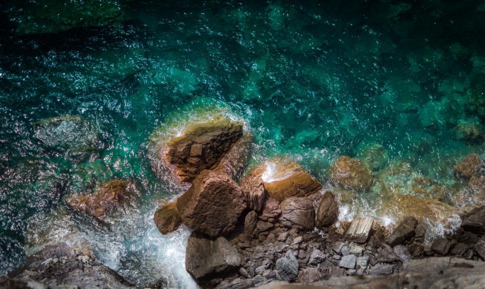 Free Stock Photo of A rocky shore with blue water | Download Free ...