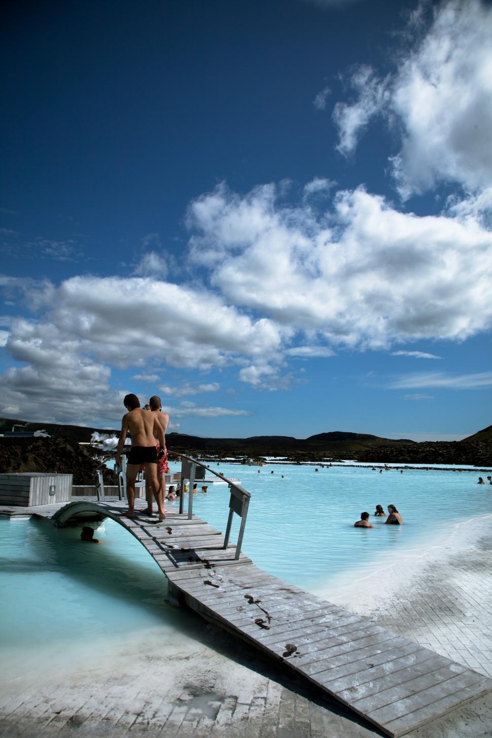 Free Stock Photo of A group of people on a bridge over a body of water ...