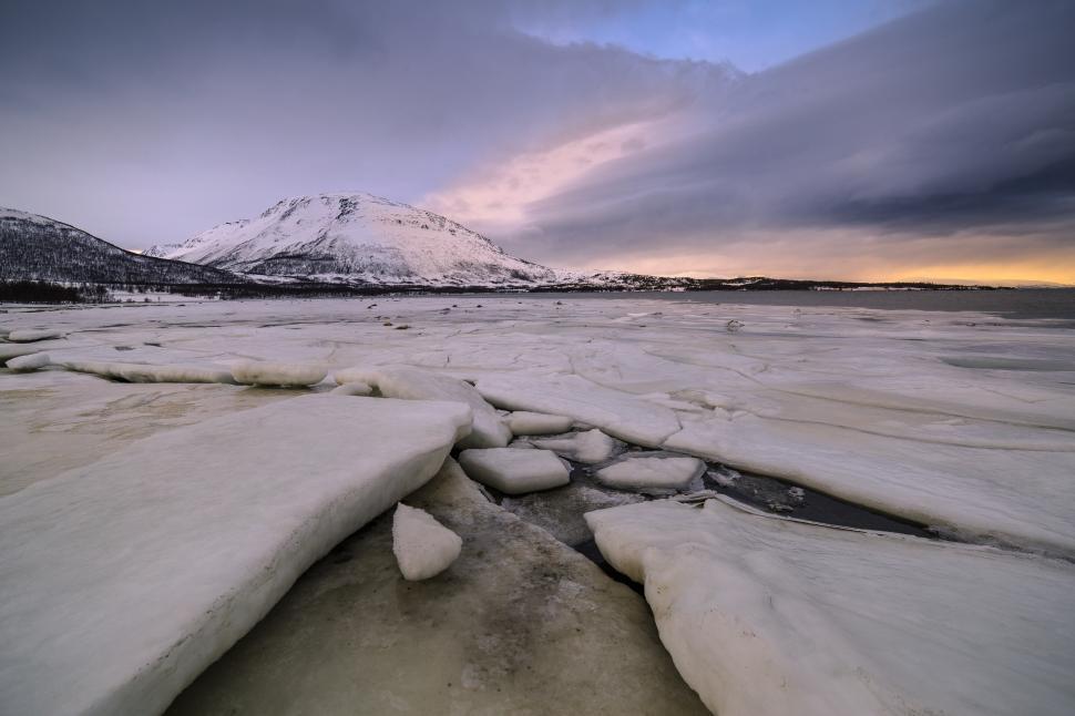Free Stock Photo of A snowy landscape with a mountain in the background ...