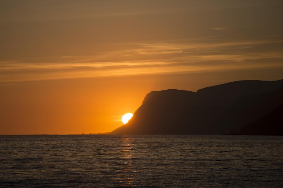 Free Stock Photo of A sunset over a body of water | Download Free ...