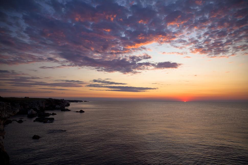 Free Stock Photo of A sunset over a body of water | Download Free ...
