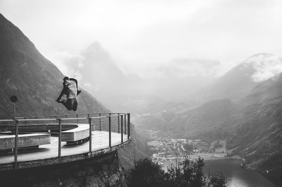 Free Stock Photo of A man jumping off a bridge over a mountain ...
