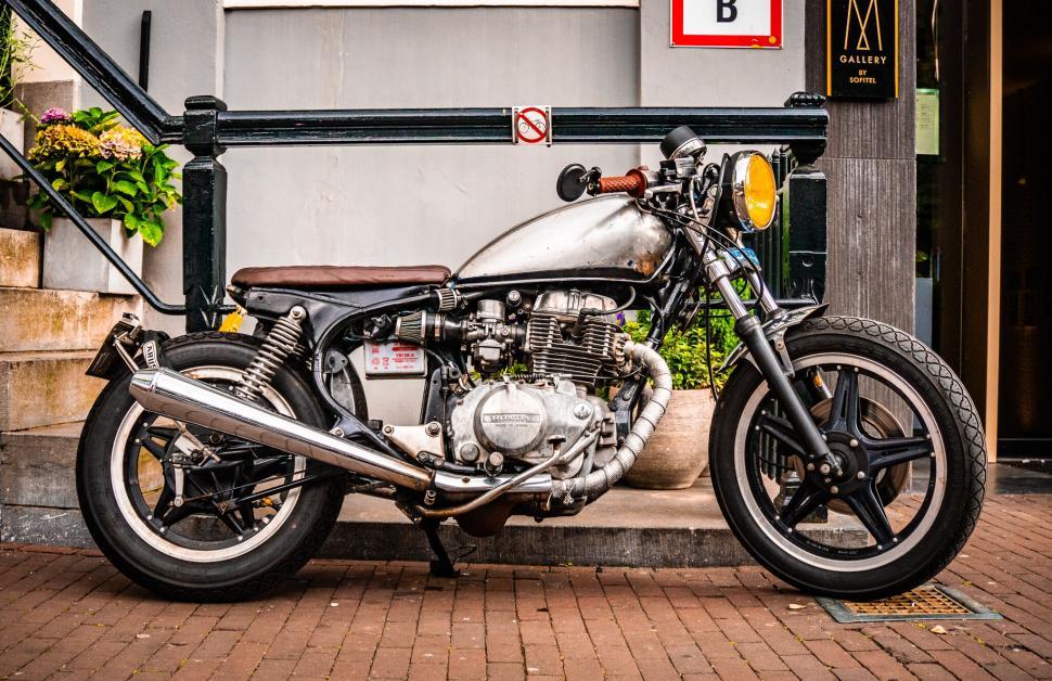Free Stock Photo of A motorcycle parked on a brick sidewalk | Download ...