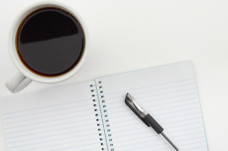 Free Stock Photo of A cup of coffee and a pen on a notebook | Download ...