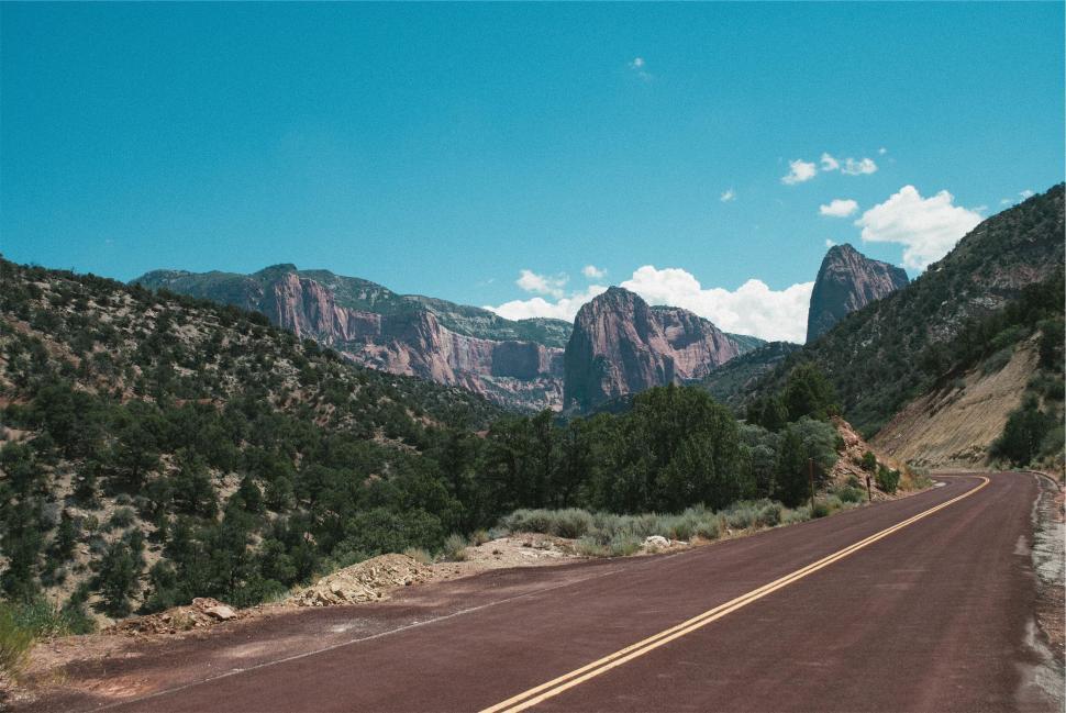 Free Stock Photo of A road with trees and mountains in the background ...