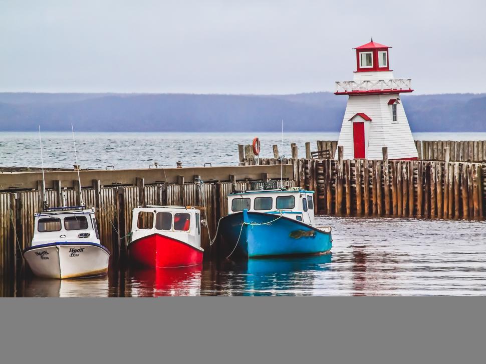 Free Stock Photo of Colorful boats and lighthouse at wooden pier ...