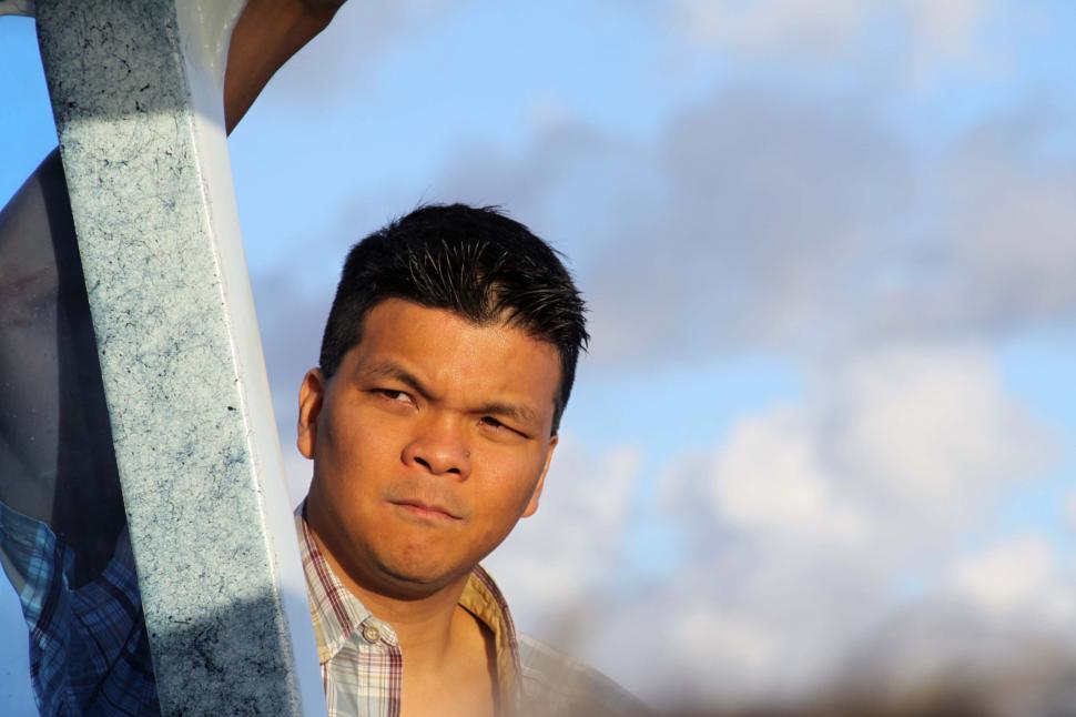 Free Stock Photo of Man peering around corner with intense gaze ...