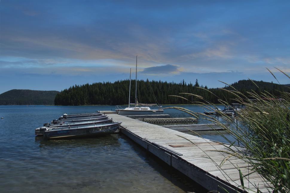 Free Stock Photo of Tranquil lakeside dock with sailing boats ...