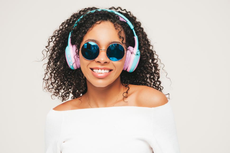 Free Stock Photo of A woman wearing headphones and smiling | Download ...
