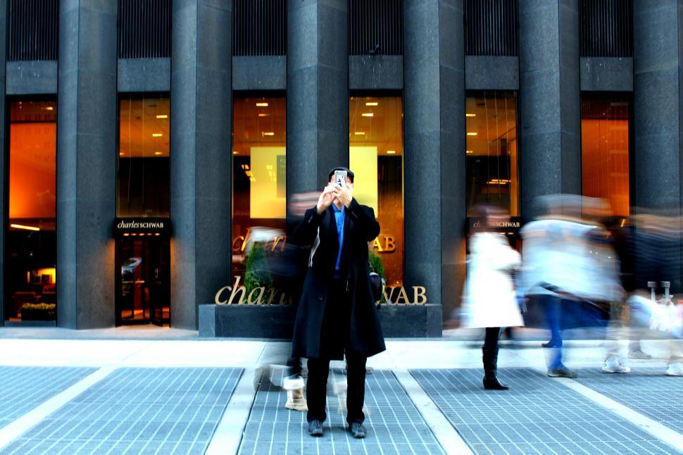 Free Stock Photo of Man photographing in front of a modern building ...