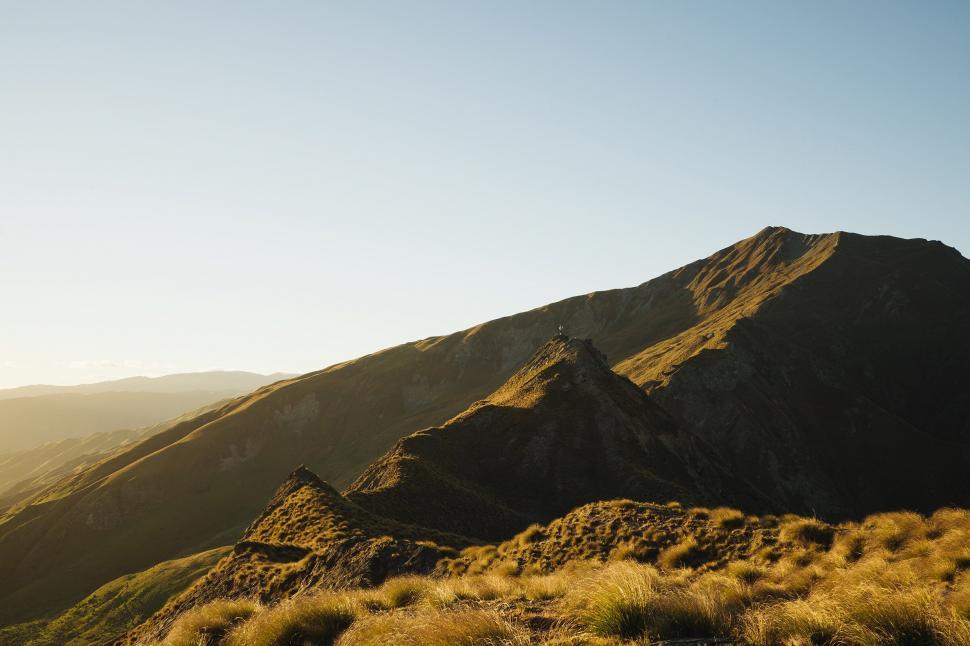 Free Stock Photo of Sunrise illuminating a rugged mountain ridge ...