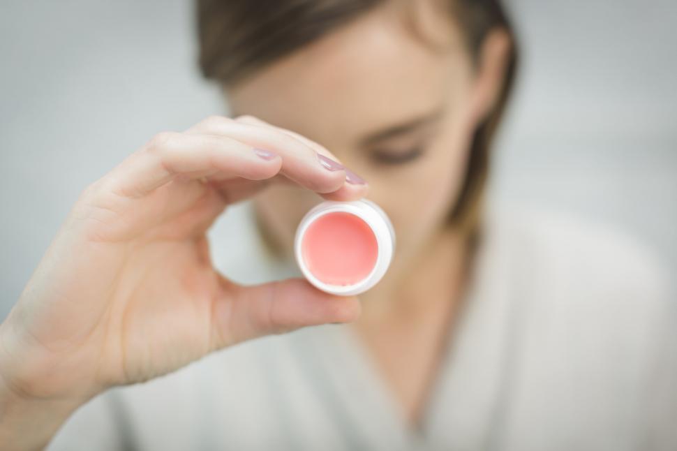 Free Stock Photo of Blurred face holding a square object in focus ...