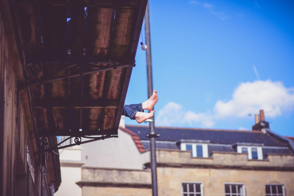 Free Stock Photo of Person s leg dangling from a building | Download ...