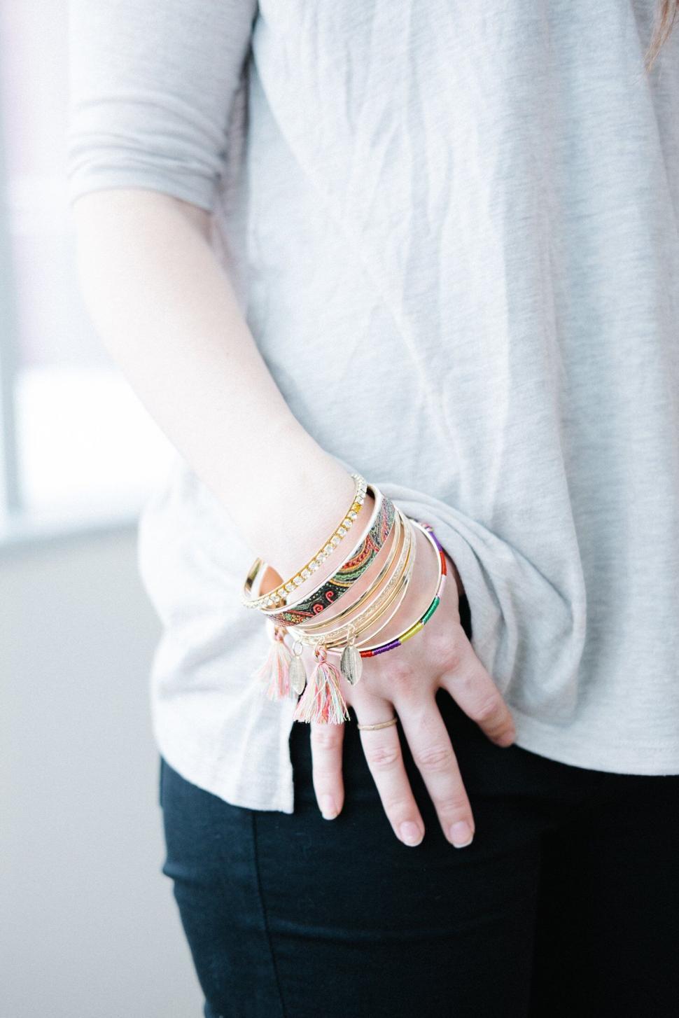Free Stock Photo of Arm adorned with an array of colorful bracelets ...