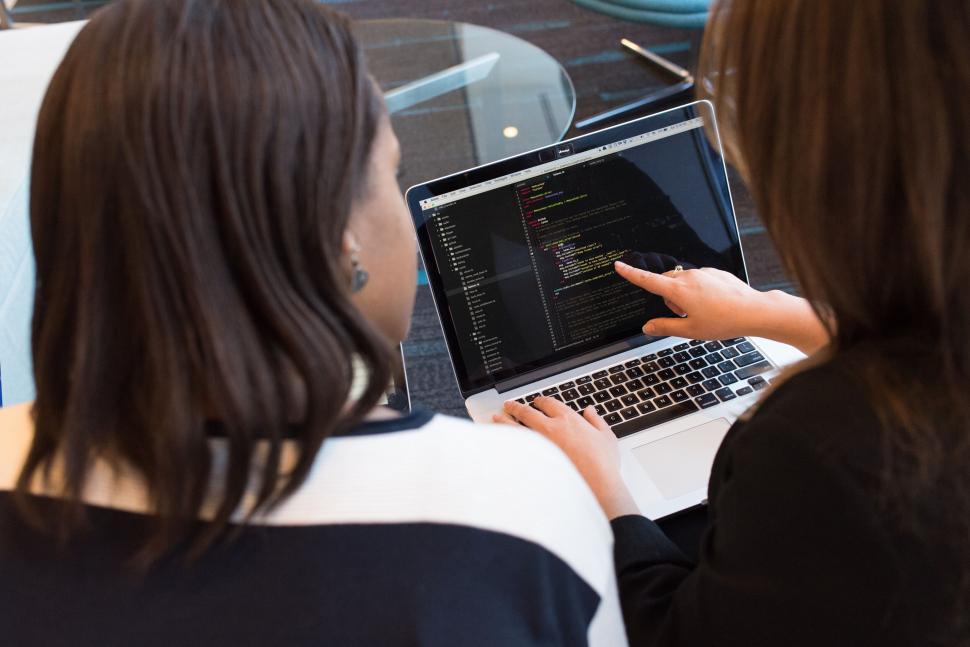 Free Stock Photo of Two women collaborating on a coding project ...