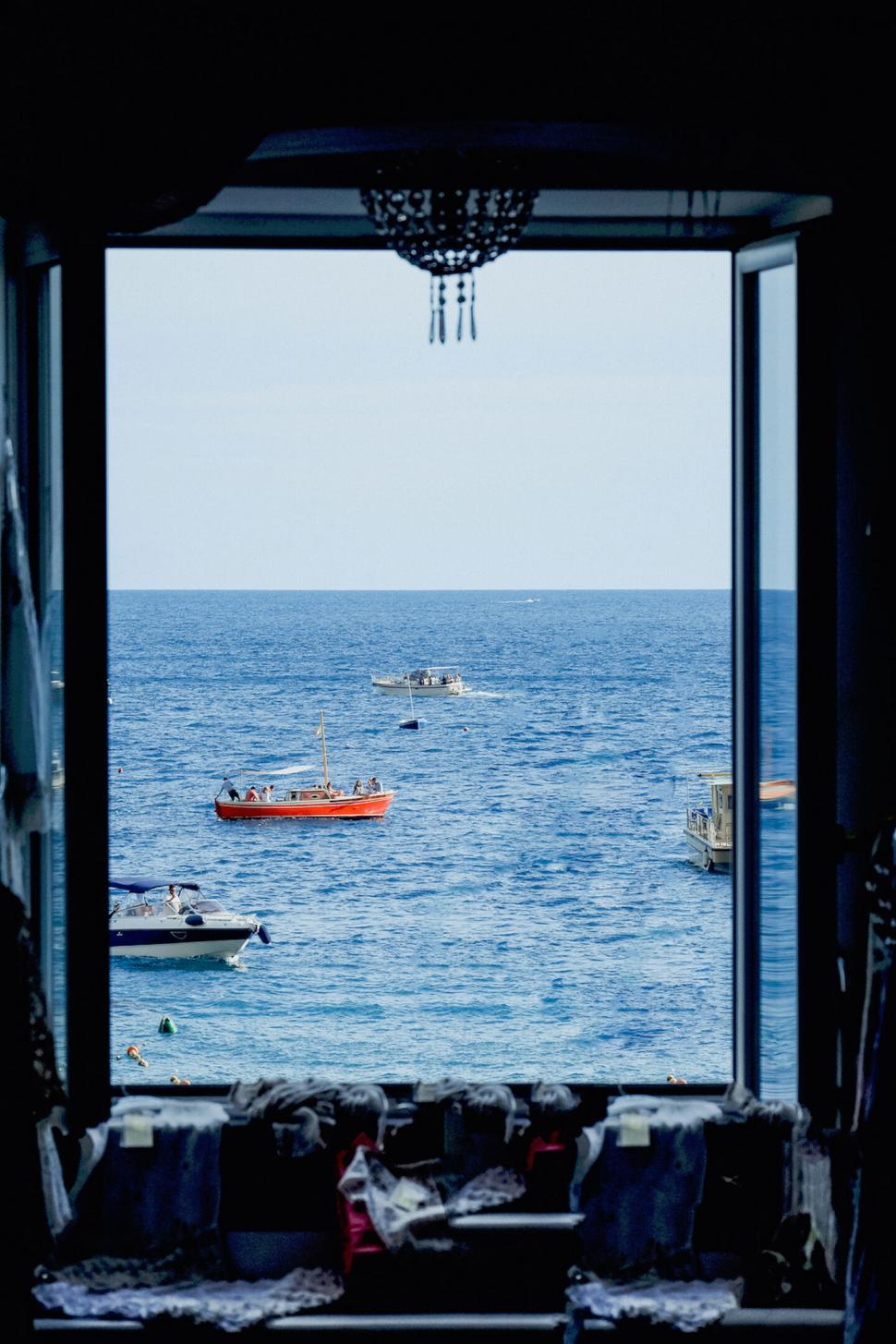 Free Stock Photo of Ocean view from a window with laundry hanging ...