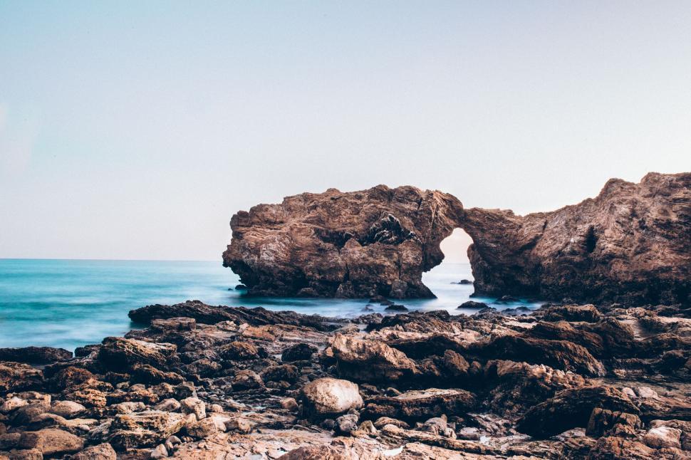 Free Stock Photo of Rock arch formation along a tranquil sea | Download ...