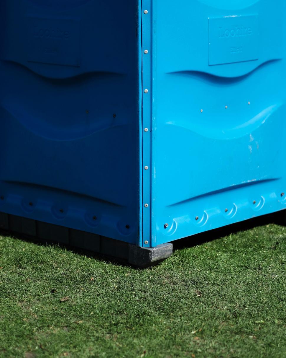 Free Stock Photo of Blue portable toilet isolated on green grass ...