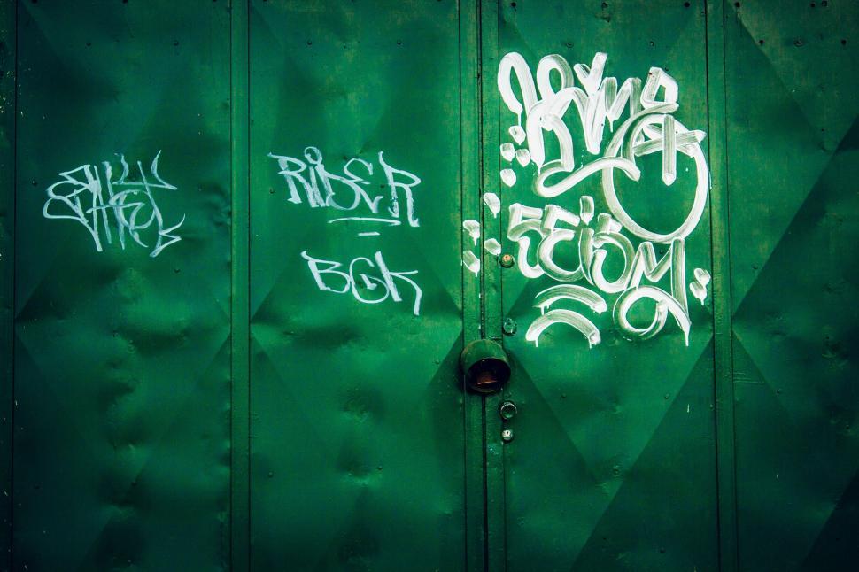 Free Stock Photo of Graffiti on a green metallic door with rust ...