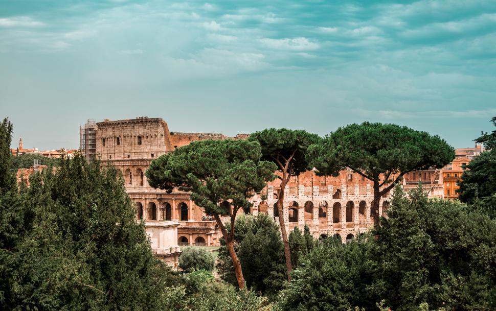 Free Stock Photo of Ancient Colosseum surrounded by lush trees in Rome ...