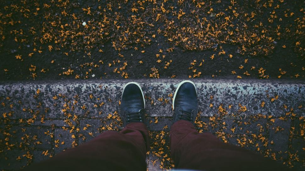 Free Stock Photo of Looking down on feet with fallen leaves around ...
