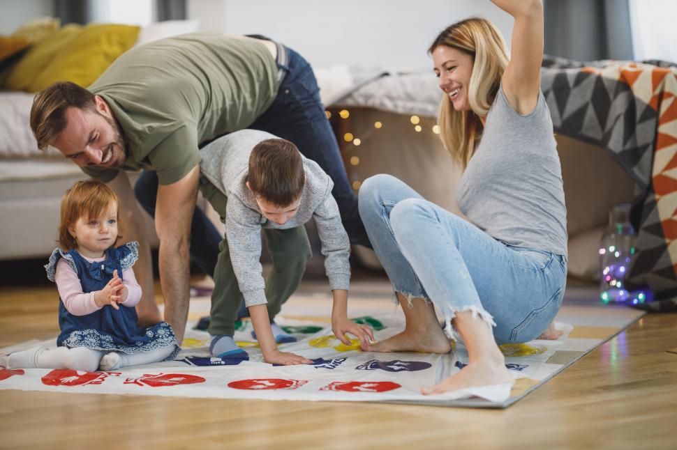 Free Stock Photo of Family playing on floor with children s game ...