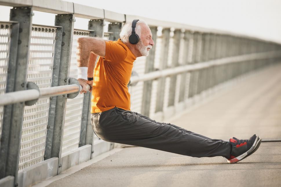 Free Stock Photo of Man relaxing legs on railing post workout ...