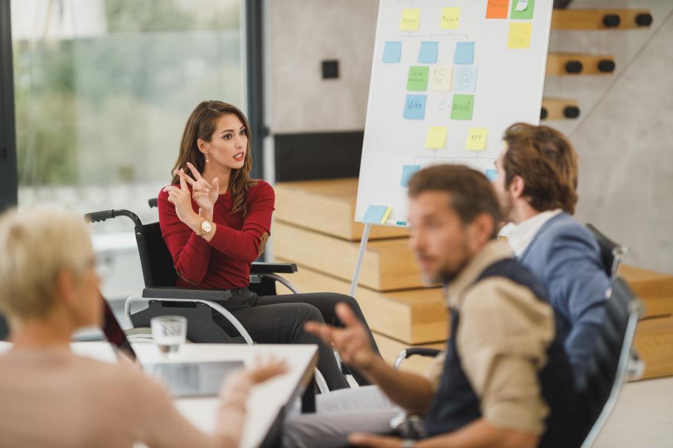 Free Stock Photo of Woman leading a business meeting discussion ...