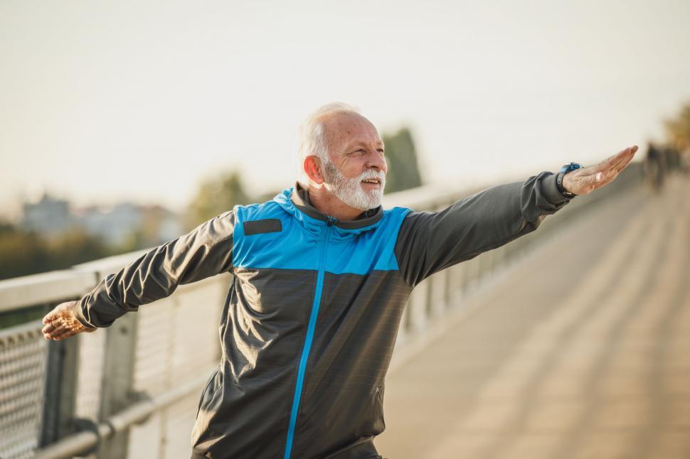 Free Stock Photo of Senior man exercising on city bridge | Download ...