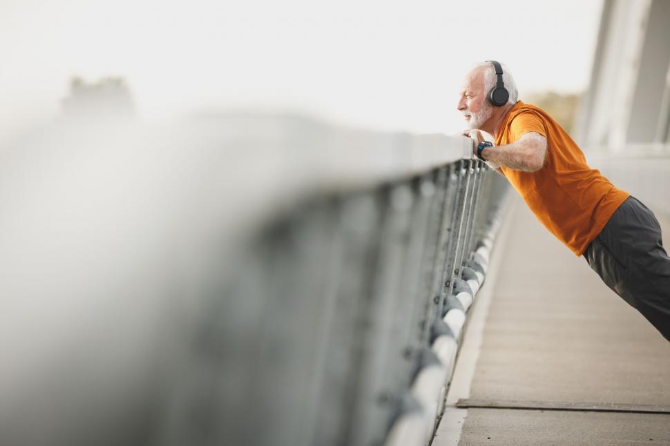 Free Stock Photo of Man stretching on a bridge during an outdoor ...