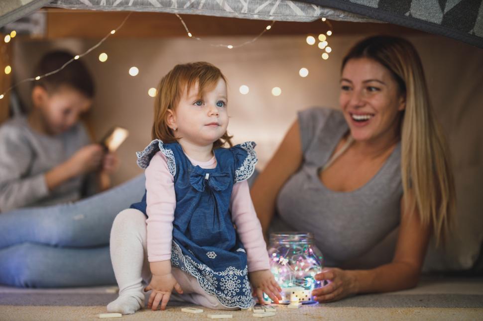 Free Stock Photo of Child playing in a homemade fort with mother ...